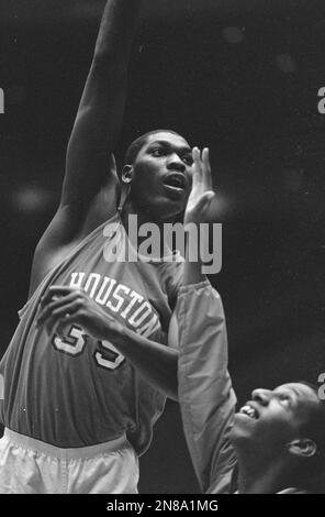 University of Houston's Akeem Abdul Olajuwon (34) slaps the basketball ...