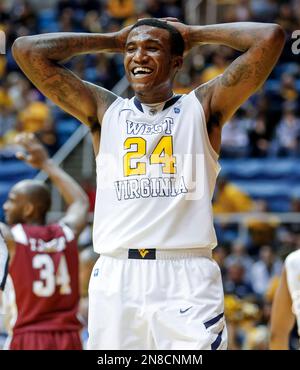 West Virginia's Aaric Murray (24) is defended by Radford's Kion Brown ...