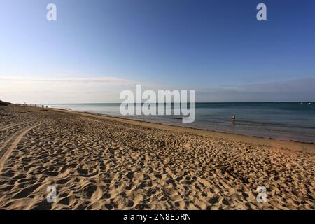 Sandy quiet beach with a lone swimmer, Ile de |R|e, Charente Maritime ...