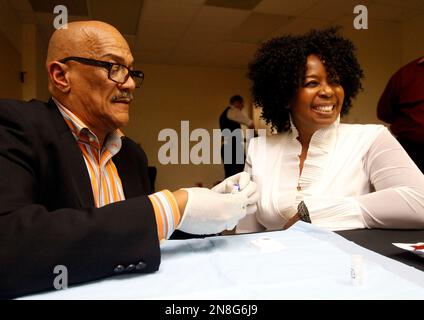 AHF HIV testing Counselor, Boyd Bowen demonstrates the Insti HIV-1 ...