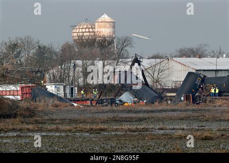Officials work the scene of derailed freight train tank cars in ...
