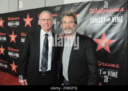 From left, Greg Wasson, CEO of Walgreen Co. and Quinton Aaron attend ...