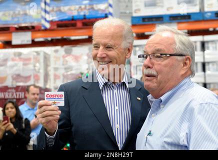 Costco co-founder Jim Sinegal (L) greets store employee Marsha Nichols ...