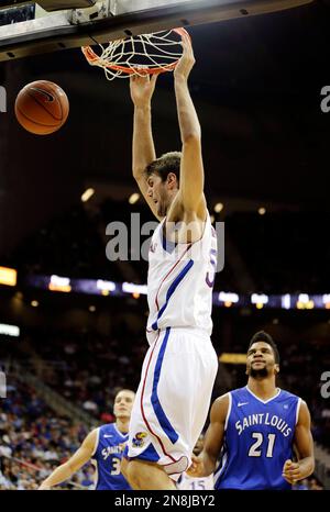 Kansas center Jeff Withey (5) dunks during the first half of an NCAA ...