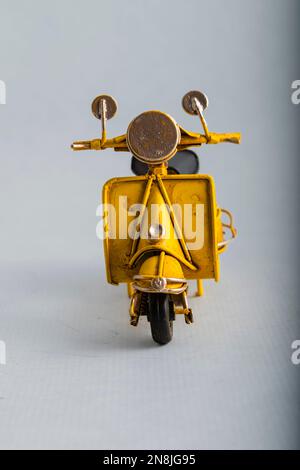 The photograph of a yellow motorcycle vintage collection figures in ...
