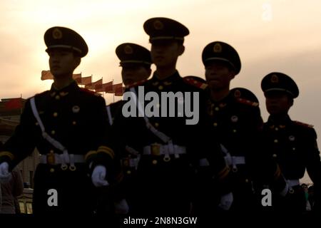 Chinese paramilitary policemen patrol the Tian'anmen Square on a ...