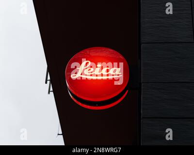 Leica camera logo sign on the outside of camera store reflecting in the ...