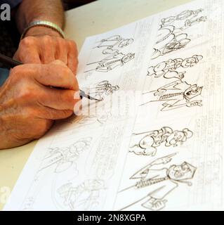 Hy Eisman, 85, works on deadline drawing a Popeye cartoon at his home ...