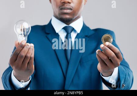 Businessman holding a light bulb with BITCOIN CASH inscription, new ...