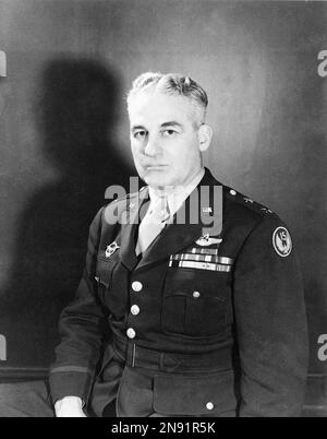 Lt. General Carl A. Spaatz and his staff stand at attention while a ...