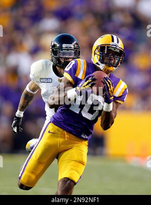 LSU wide receiver Russell Shepard holds back McNeese State cornerback ...