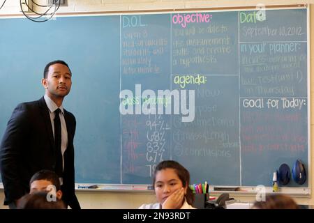 JCP Cares Supporter John Legend, third from right, presents a $5000 ...