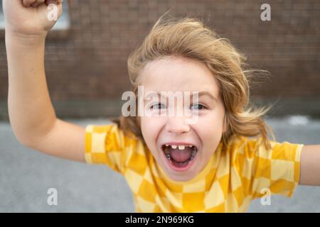 Kid boy with angry expression. Angry hateful little aggression boy ...