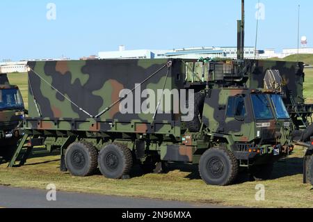 A Medium Tactical 6x6 Cargo Truck from Oshkosh Defense offloads ...
