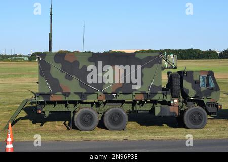 A Medium Tactical 6x6 Cargo Truck from Oshkosh Defense offloads ...