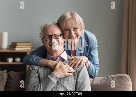 Photo of elderly man happy positive smile sit bed house wear pajamas ...