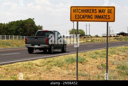 Hitchhikers may be escaping inmates sign. Between Hondo and Sabinal ...