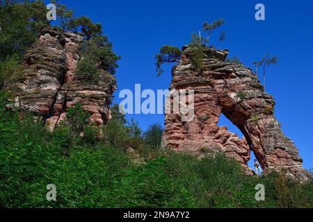Hiker at the Schillerfelsen, red sandstone rocks on the Dahner ...