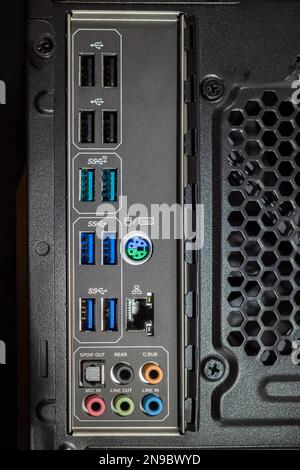 The back of the desktop computer with various inputs, USB sockets, fan ...