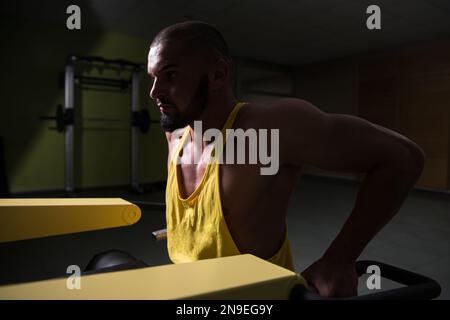 Muscular Fitness Bodybuilder Doing Heavy Weight Exercise For Shoulders ...