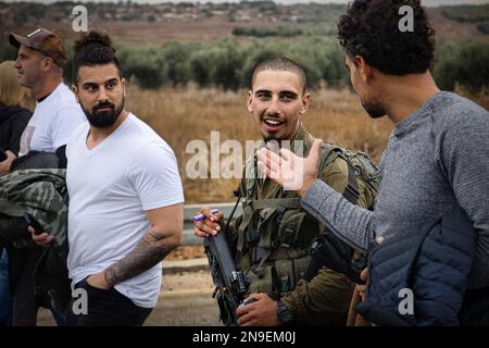 A Golani soldier smiling in uniform during an army ceremony in Israel ...
