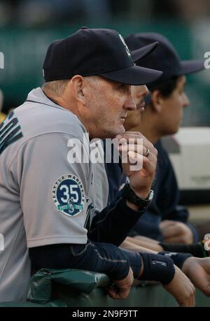 Seattle Mariners bench coach Robby Thompson, left, congratulates Raul ...