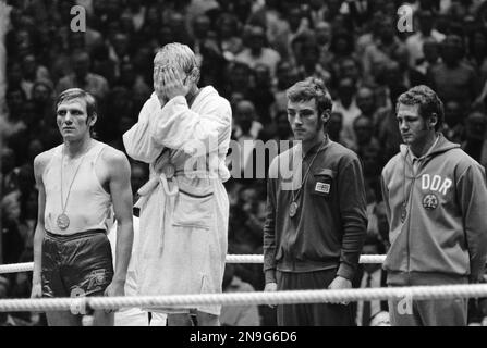 German light-middleweight boxer Dieter Kottysch (2nd of left) shows his ...