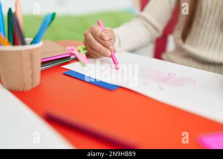 Adorable hispanic girl preschool student smiling confident drawing on ...