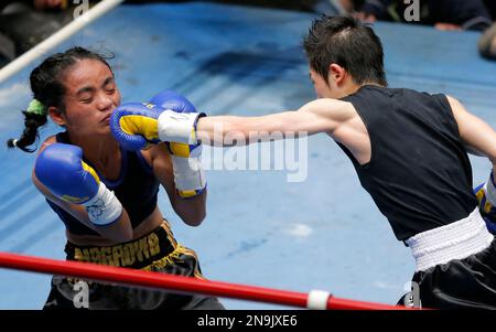 Japanese champion Momo Koseki, right, sends a left to Philippine ...