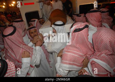 Relatives from the Saudi royal family pray during the funeral of the ...