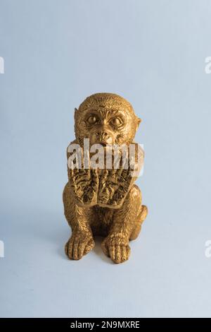 The image of the figure of a yellow plaster monkey for home decoration ...
