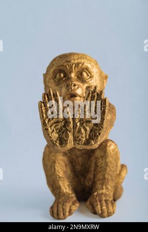 The image of the figure of a yellow plaster monkey for home decoration ...