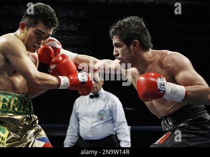 Filipino-American boxer Brian Viloria, left, throws a punch at Mexican ...