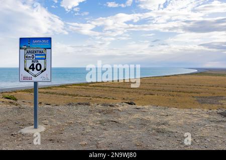 View to the coast of Cabo Virgenes and aluminum signs marking kilometer ...