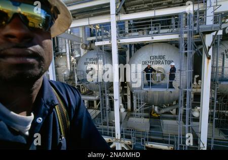 Industrial laborers at a refinery; North Slope, Alaska, United States ...