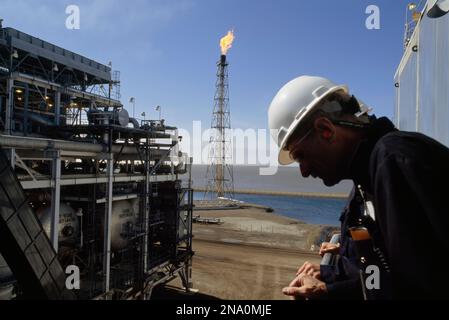 Industrial laborers at a refinery; North Slope, Alaska, United States ...