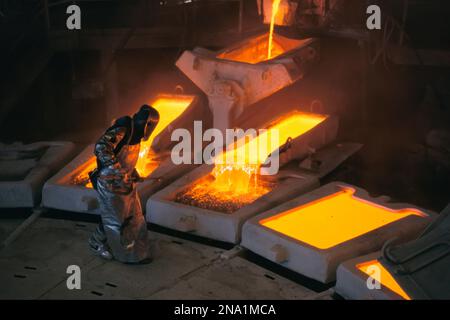 Molten copper is poured into molds at Chuquicamata Copper Refinery ...