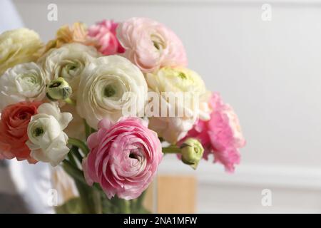Beautiful ranunculus flowers on light grey background, closeup. Space ...