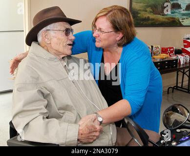 Jo Anne Yeager Sallah, right, a relief worker stationed in Gambia ...