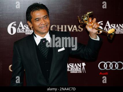 Indonesian actor Donny Damara poses with his trophy after received the ...