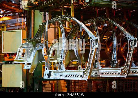 Details of car carcass hang on assembling conveyor Stock Photo - Alamy
