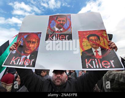 A Lebanese anti-Syrian regime salafist protester, chants slogans ...