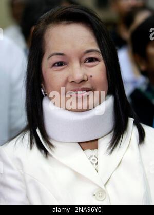 Former President and now Congresswoman Gloria Macapagal Arroyo smiles ...
