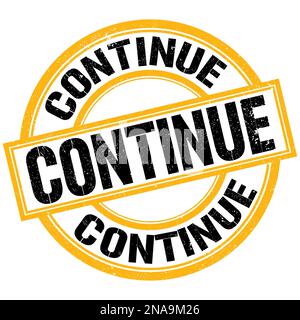CONTINUE text written on yellow-black grungy stamp sign Stock Photo - Alamy