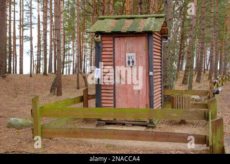 Wooden toilet for the tourists in the forest. Natural WC for hikers ...