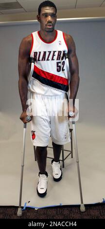 Injured Trail Blazers' Greg Oden listen to theNational Anthem before ...