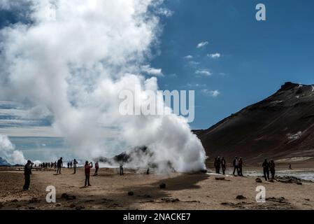 Visitors to Lake Myvatn, one of the most geologically active areas in ...