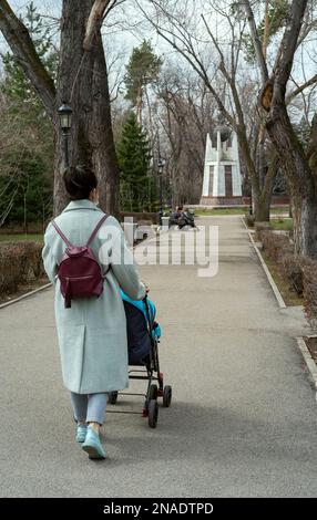 Mom and stroller with her baby Stock Photo - Alamy