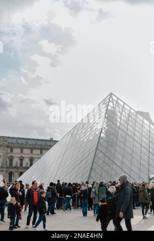 Cloudy Paris skyline Museum of Louvre and Ferris wheel in center Stock ...