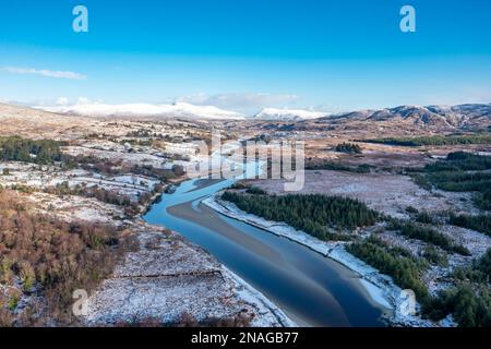 Aerial view of snow covered Gweebarra River between Doochary and ...
